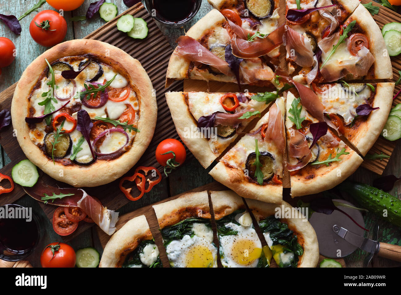 Rustic style pizza party. Homemade puffy pizzas with pancetta ...