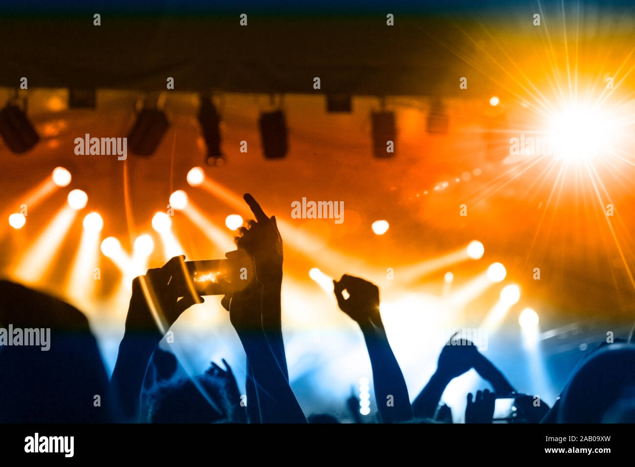 Concert crowd attending a huge gig Stock Photo - Alamy