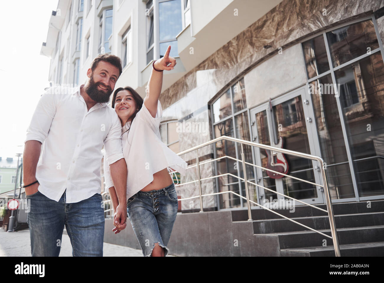 A young funny loving couple have fun on a sunny day Stock Photo - Alamy