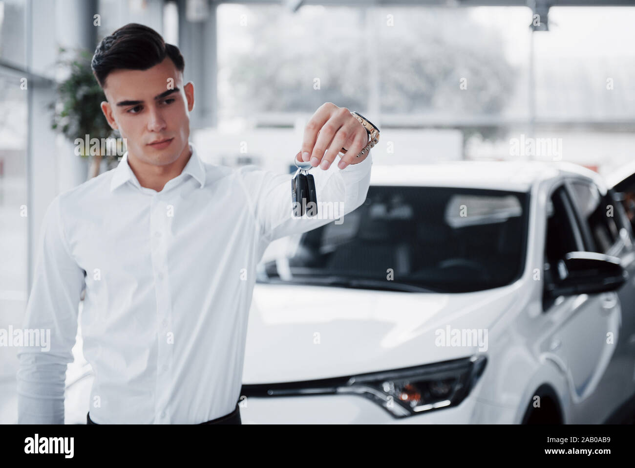 Happy young man with keys in his hands, lucky buy a car Stock Photo - Alamy