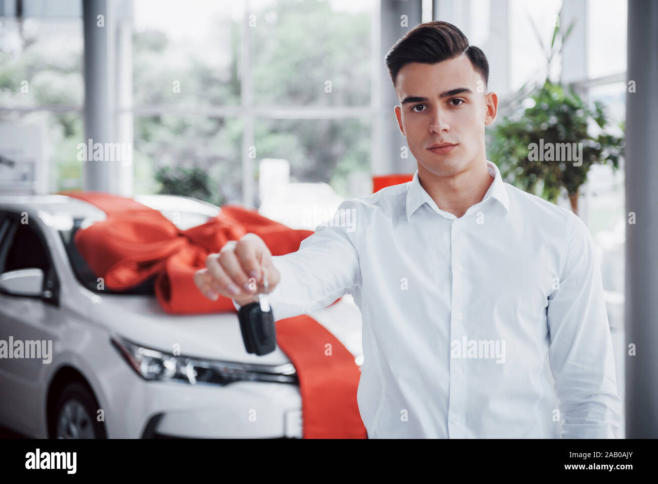 Happy young man with keys in his hands, lucky buy a car Stock Photo - Alamy