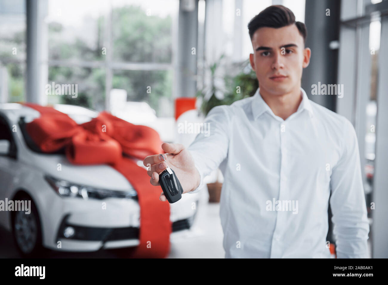 Happy young man with keys in his hands, lucky buy a car Stock Photo - Alamy
