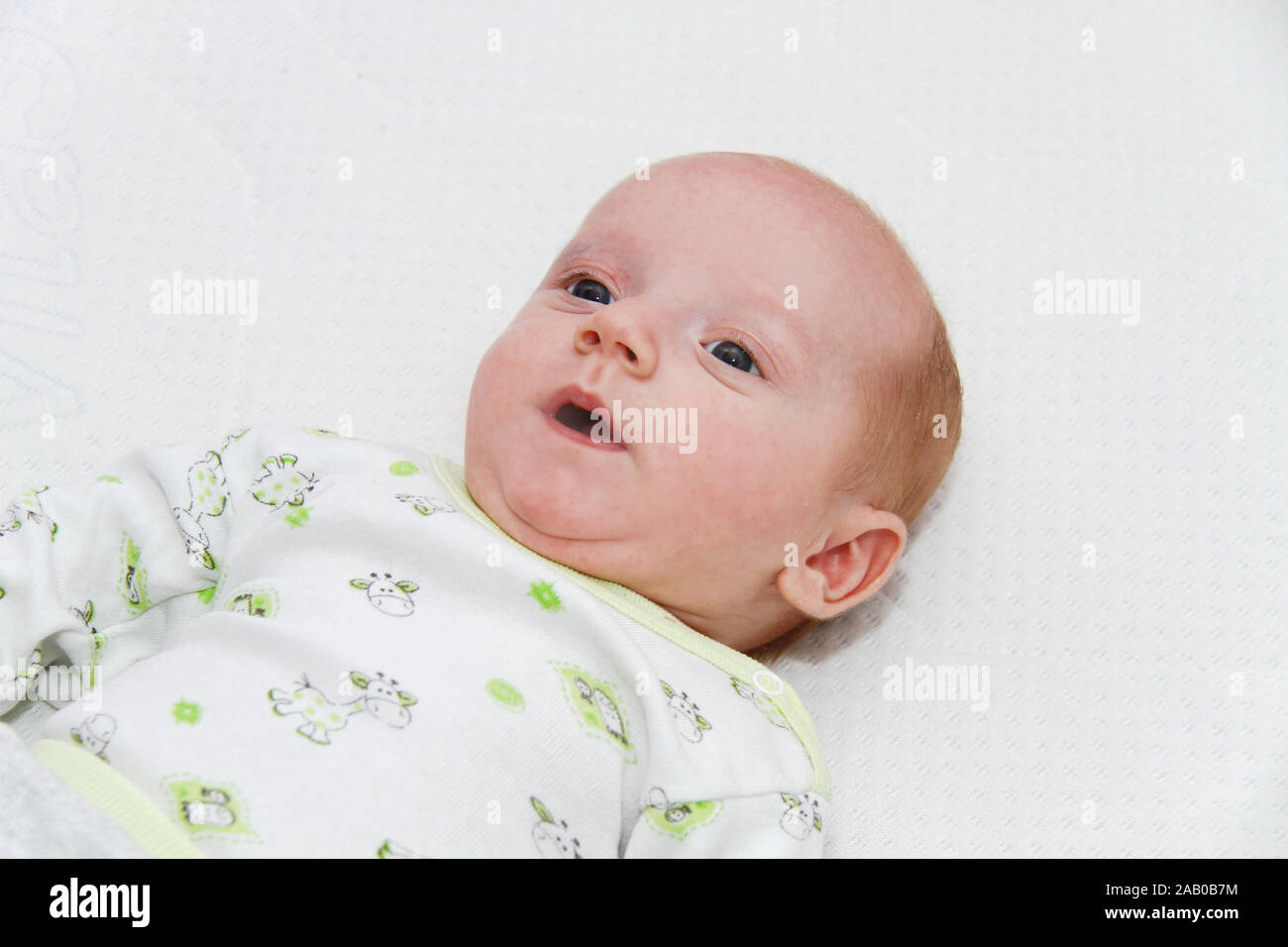 Photo of the Two months old newborn male baby enjoying Stock Photo - Alamy