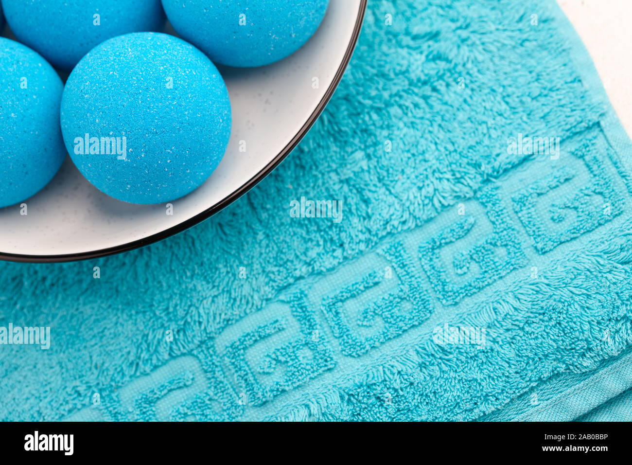 Blue bath bombs in plate on towel background, copy space Stock Photo ...