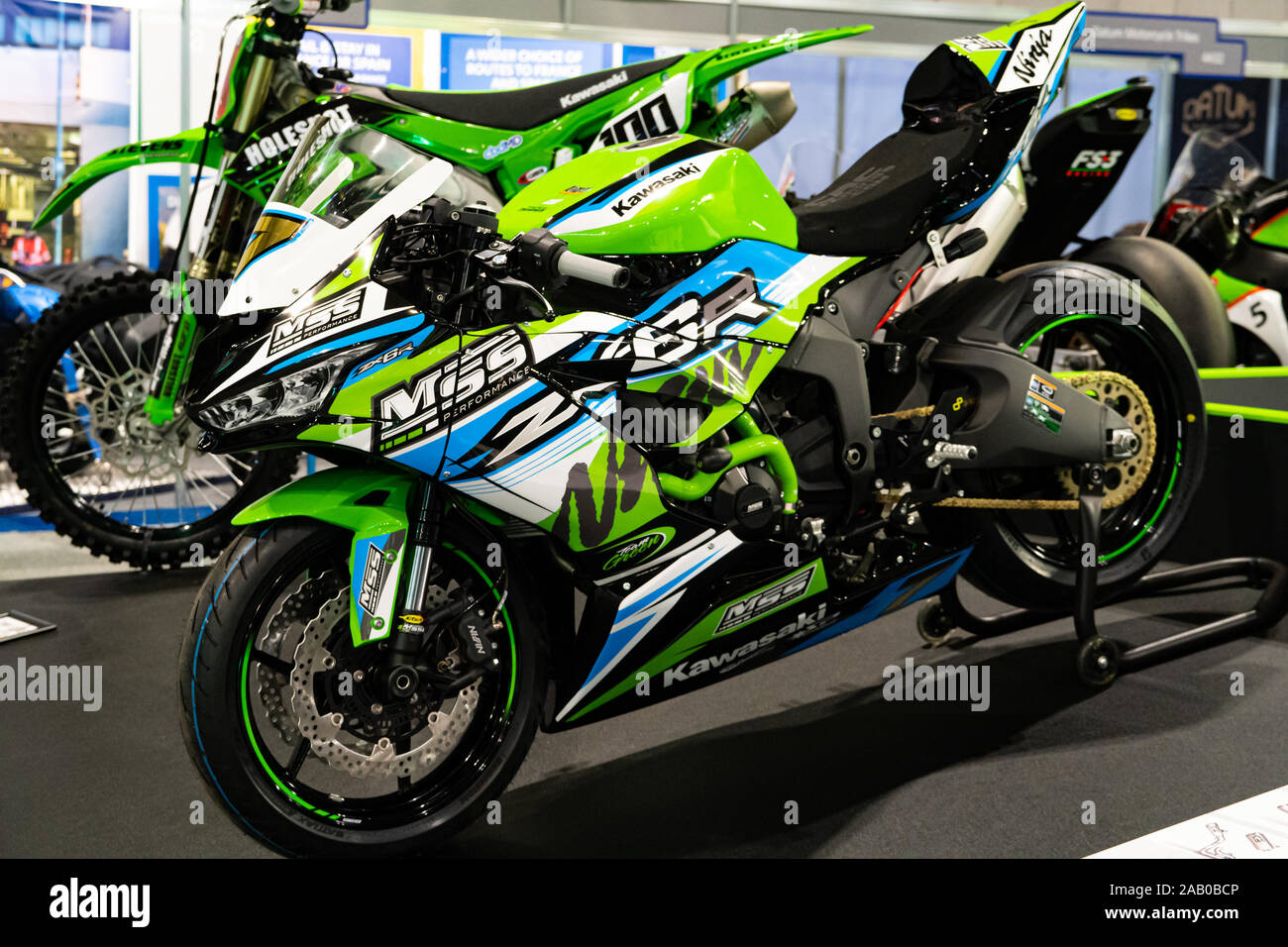 Green Kawasaki racing motorbike on display at motorcycle exhibition ...