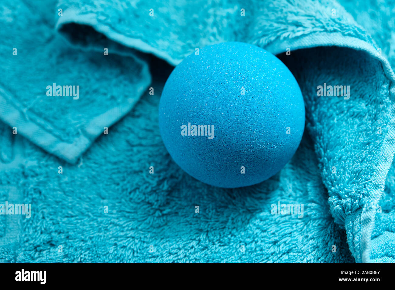 Blue bath bomb on towel background, close up view Stock Photo - Alamy