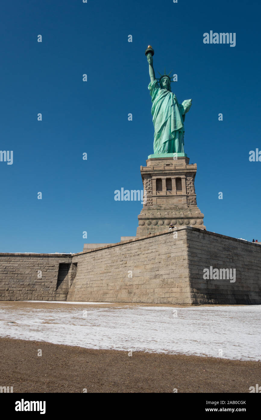 Statue of liberty, shot at liberty island in wintertime with snow and ...
