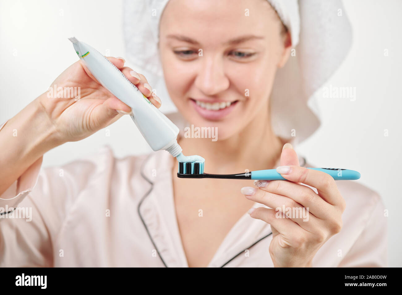 Hand of healthy young woman applying toothpaste on toothbrush Stock ...