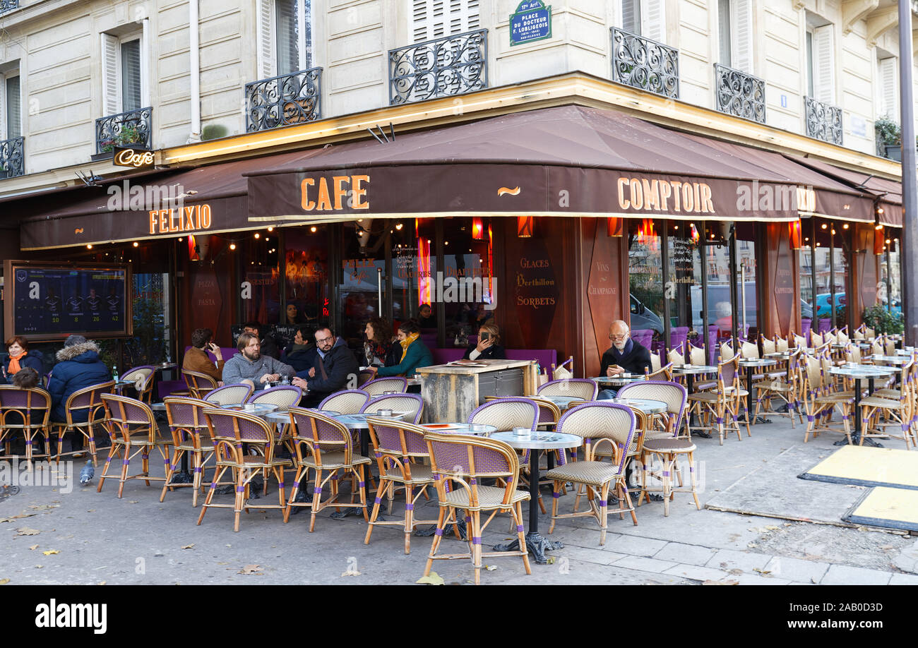 View of typical parisian cafe Copmtoir located near Batignolles park in ...