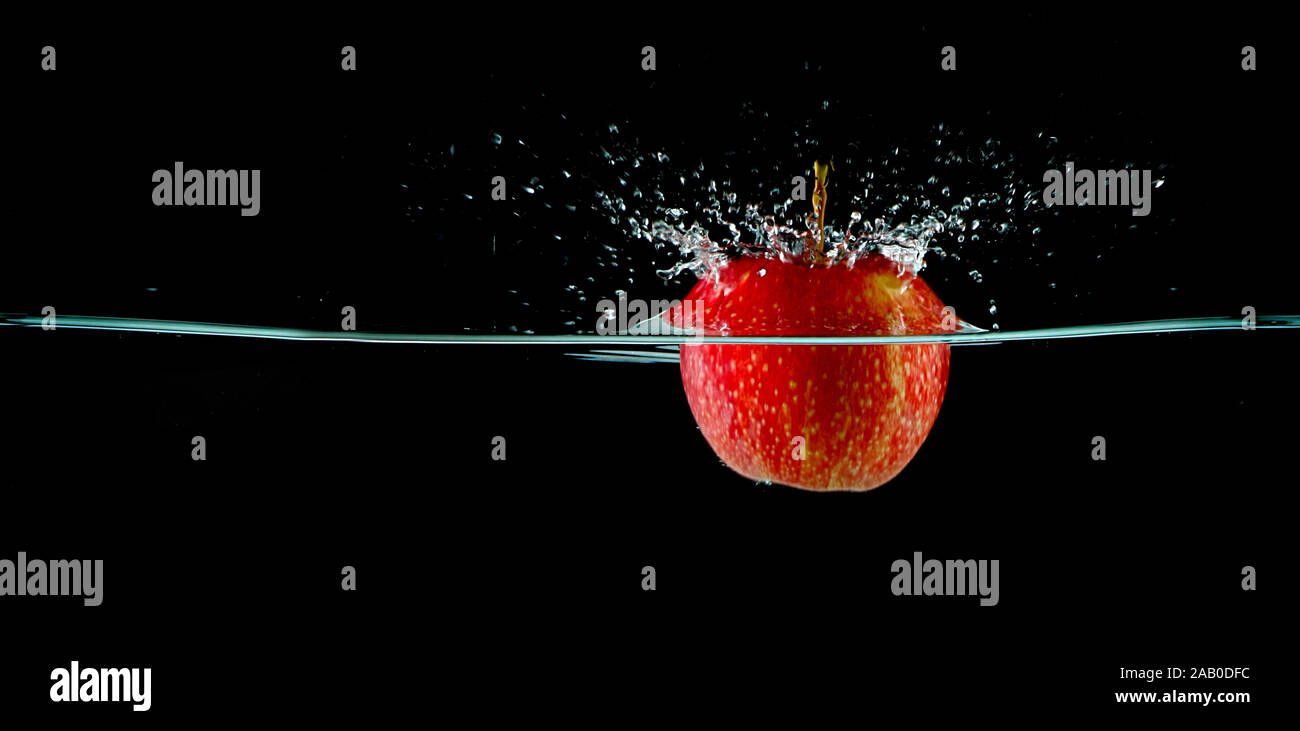 Green apple falling water in hi-res stock photography and images - Alamy