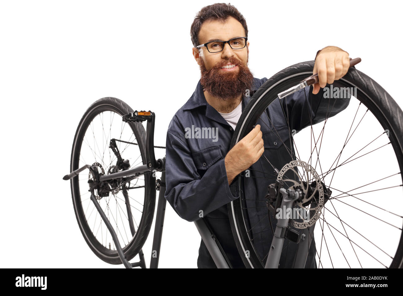 Repairman fixing a bicycle isolated on a white background Stock Photo ...