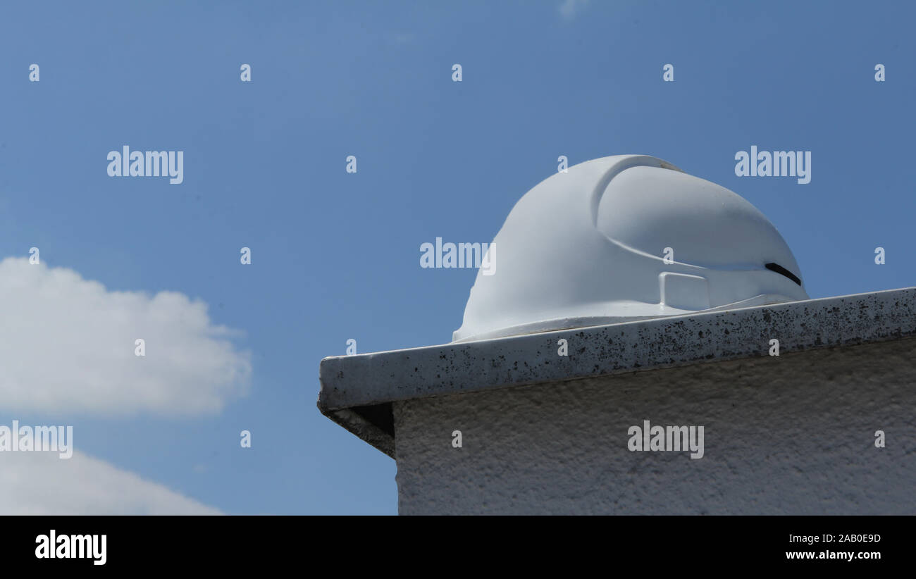 white safety helmet on roof top Stock Photo - Alamy