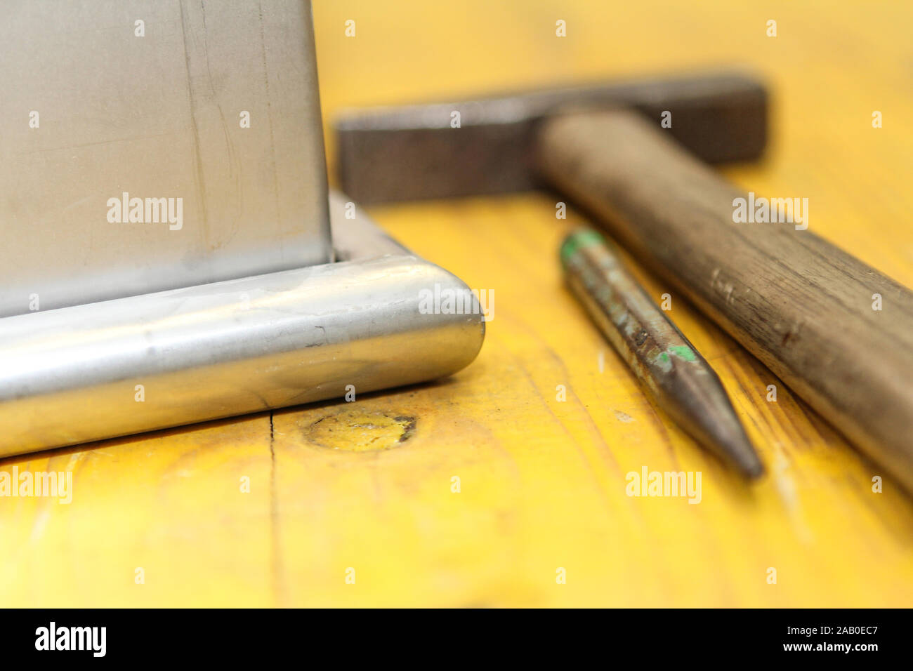 hammer and chisel tools for plumbers Stock Photo - Alamy