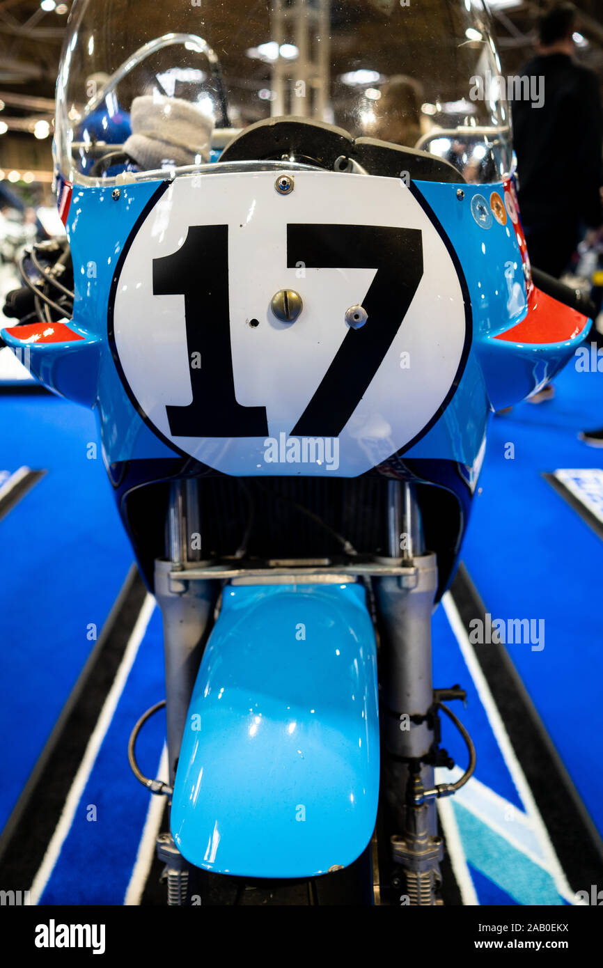 Blue racing motorcycle number 17 with windscreen at motor show display ...