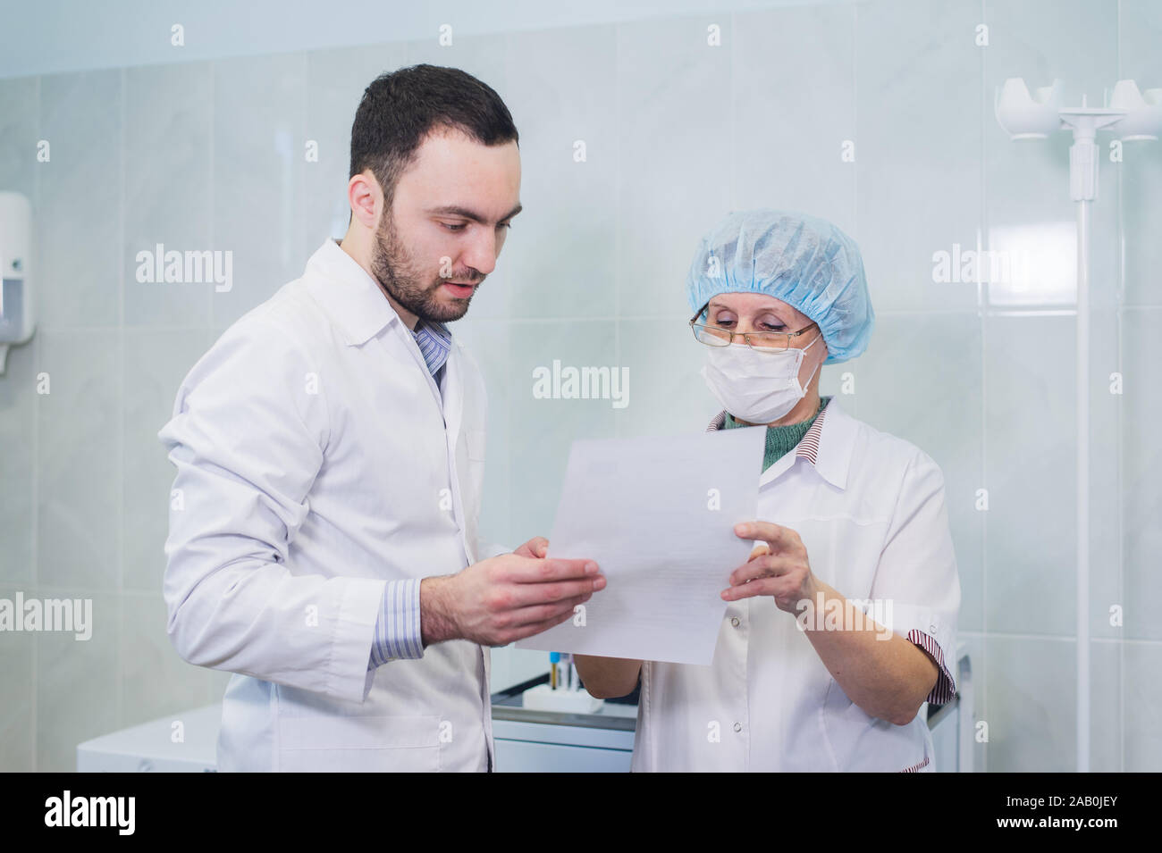 Healthcare: Doctor and patient discussing blood-test results Stock ...
