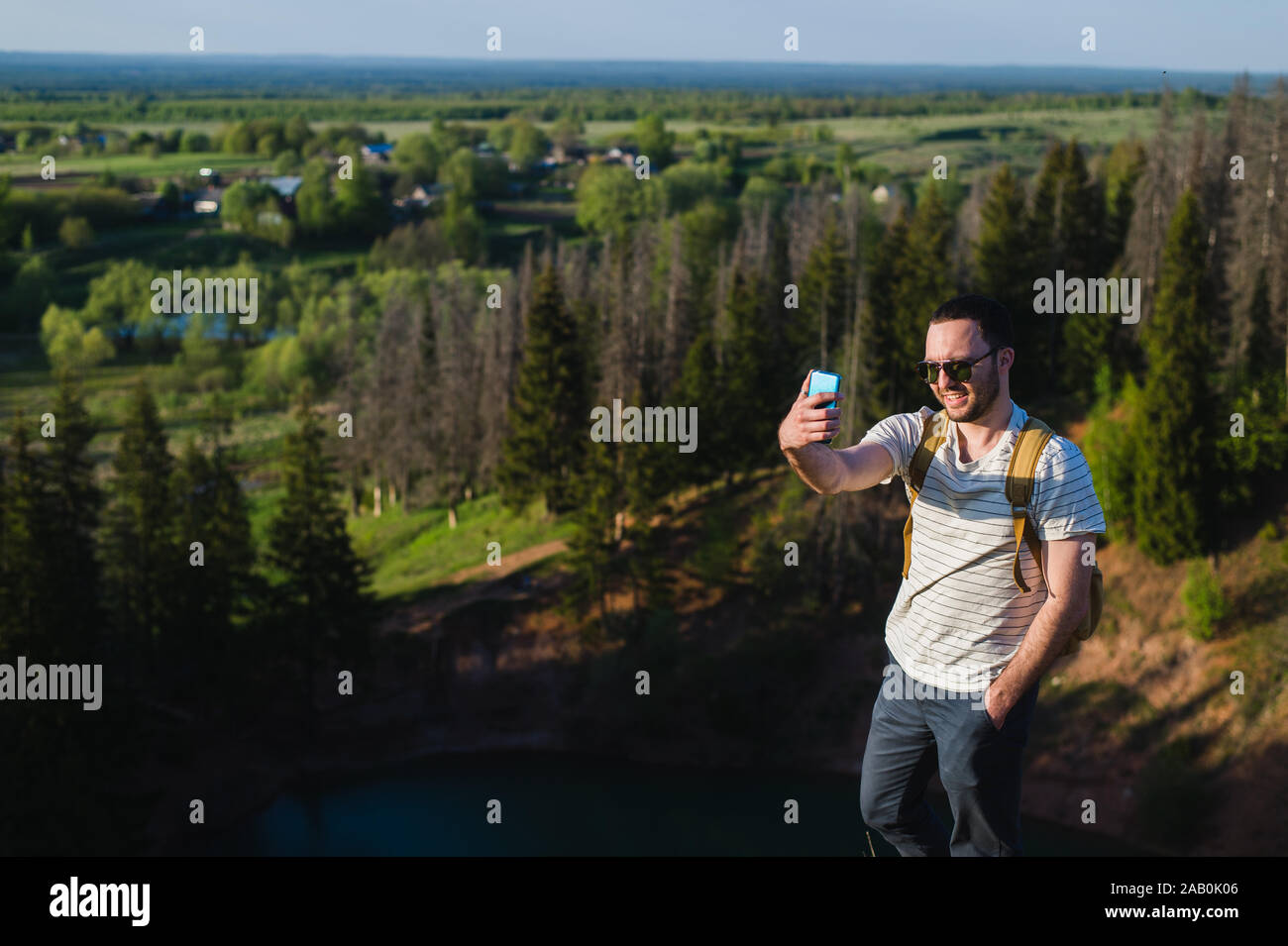 Handsome man shooting selfie in the nature. Hiking trip. Mountaineering ...