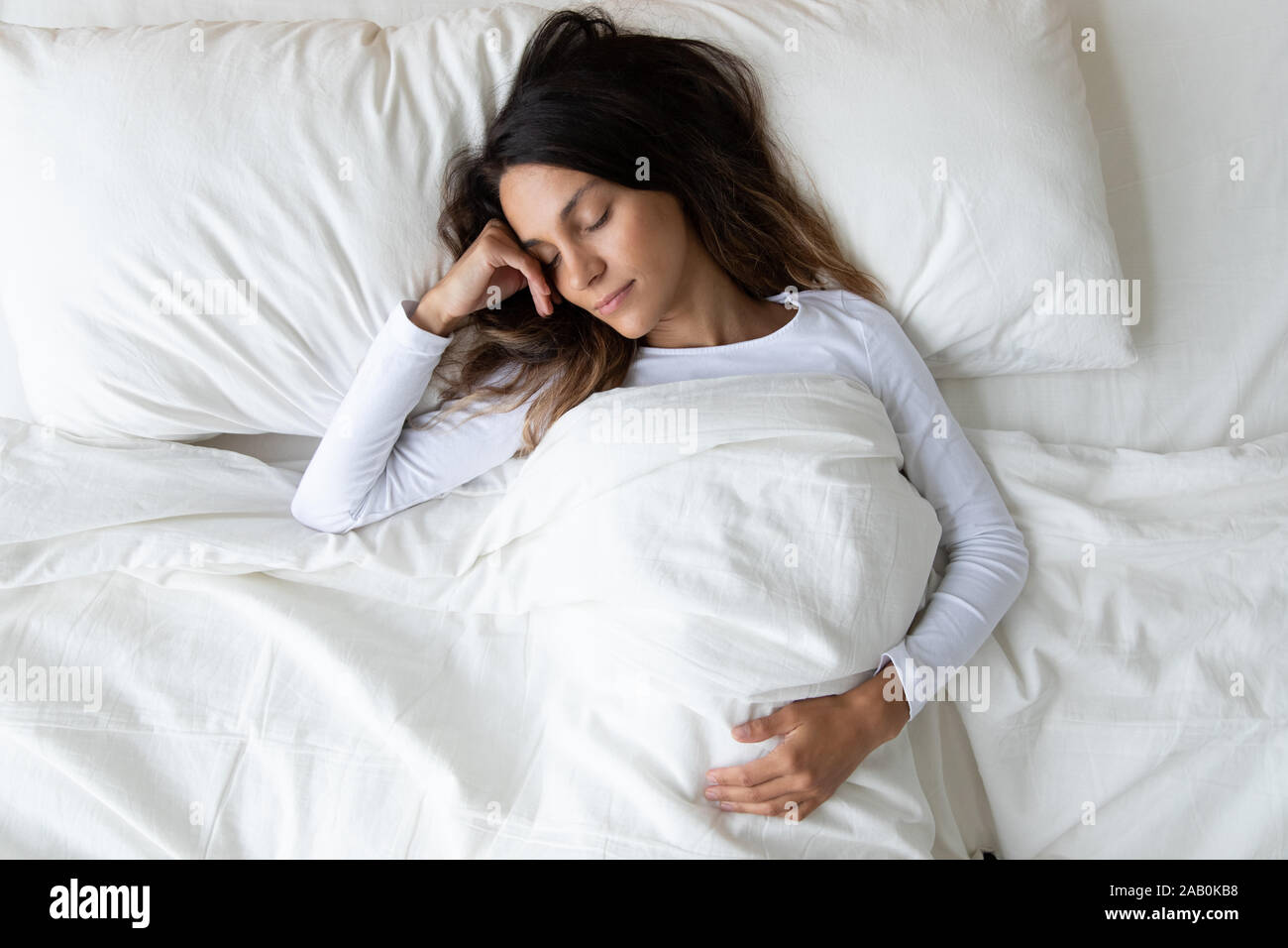 Top view 30s woman sleeping in bedroom at home alone Stock Photo - Alamy