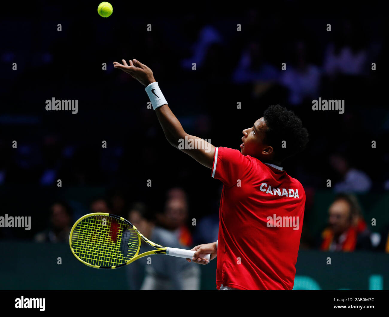 Felix Auger-Aliassime of Canada serves against Roberto Bautista Agut of Spain during Day 7 of ...