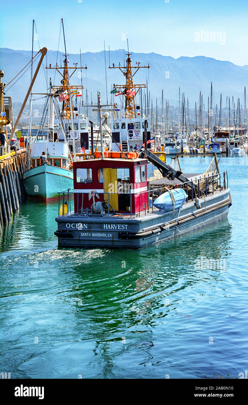 The Ocean Harvest, a commercial fishing boat, launches from the docks ...