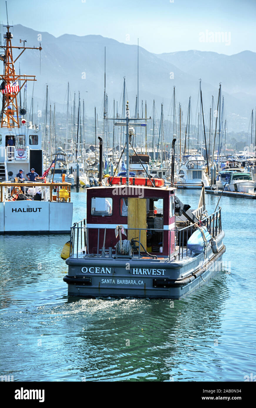 The Ocean Harvest, a commercial fishing boat, launches from the docks ...