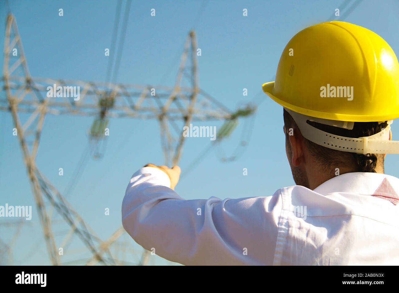 Male engineer standing at electricity station Stock Photo - Alamy