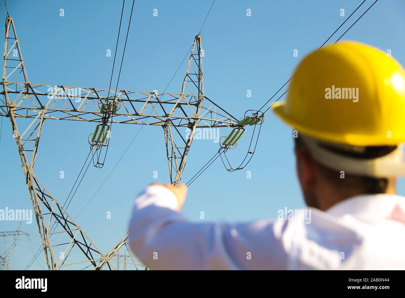 Male engineer standing at electricity station Stock Photo - Alamy