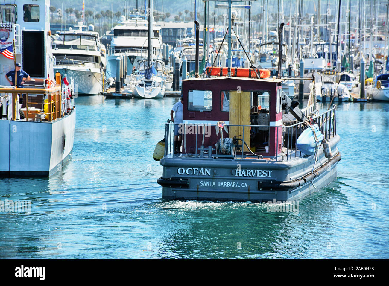 The Ocean Harvest, a commercial fishing boat, launches from the docks ...