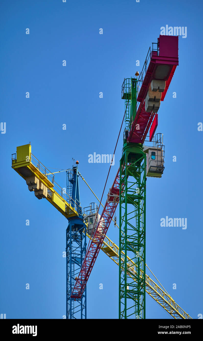 Multi coloured construction cranes, London Stock Photo - Alamy