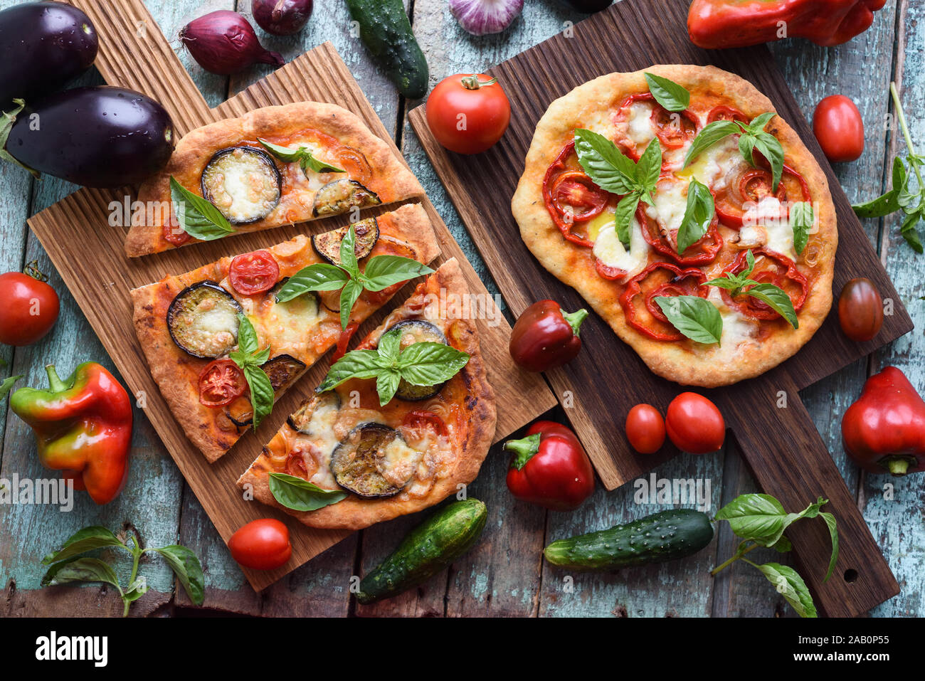 Healthy vegetarian food. Pizzas with eggplants, tomatoes and bell ...