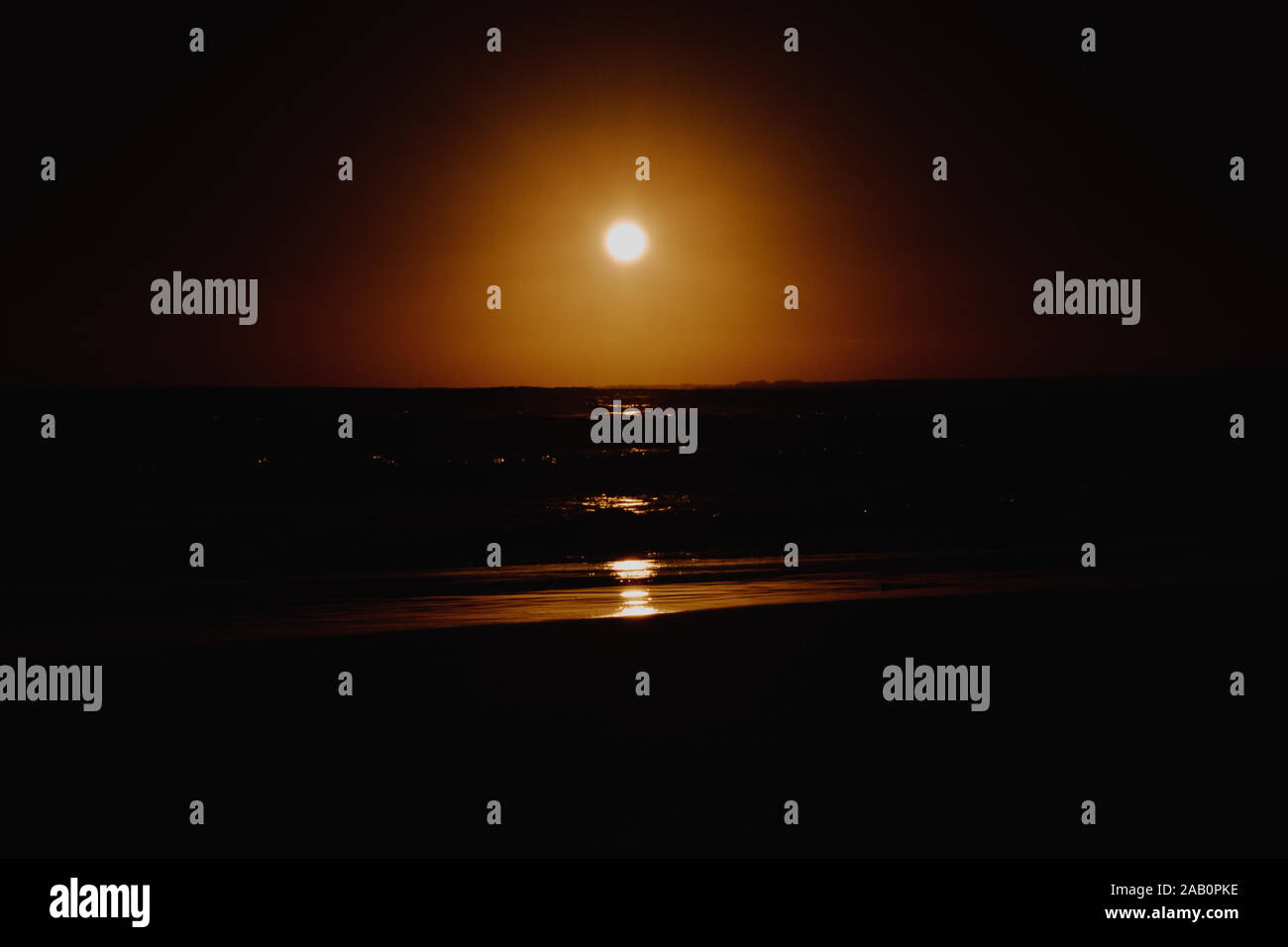 Dark sunset at the beach in Uruguay Stock Photo - Alamy