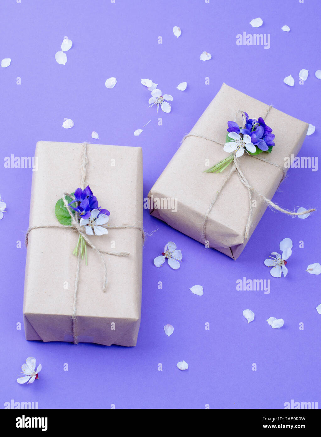Beautiful gift boxes wrapped in simple brown craft paper decorated with ...
