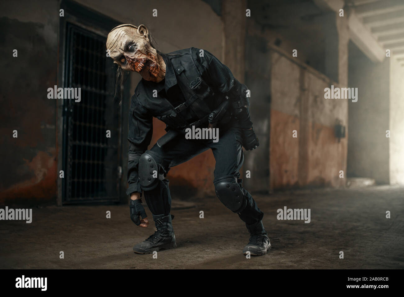 Male zombie walking in abandoned factory Stock Photo - Alamy