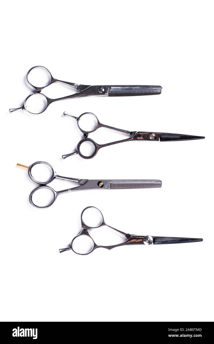 Set of hair cutting shears on white background Stock Photo - Alamy