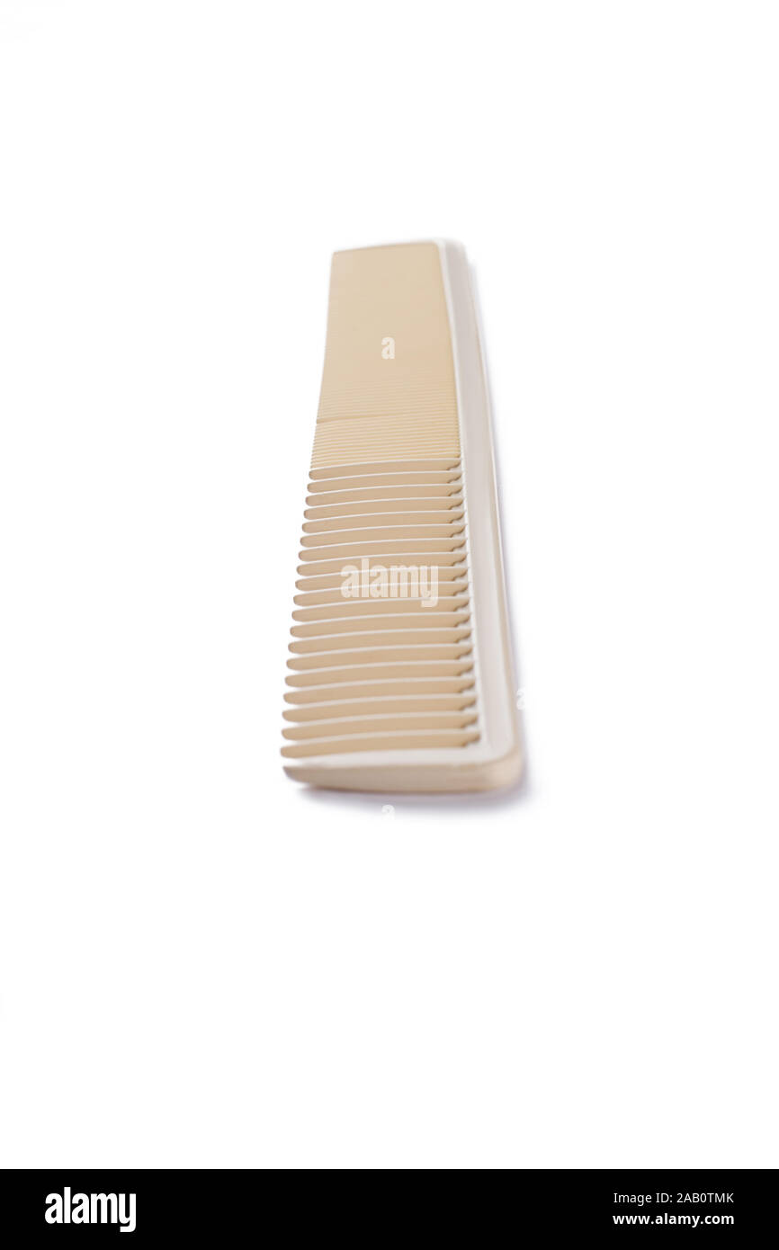 Plastic hair comb, vertical image Stock Photo - Alamy