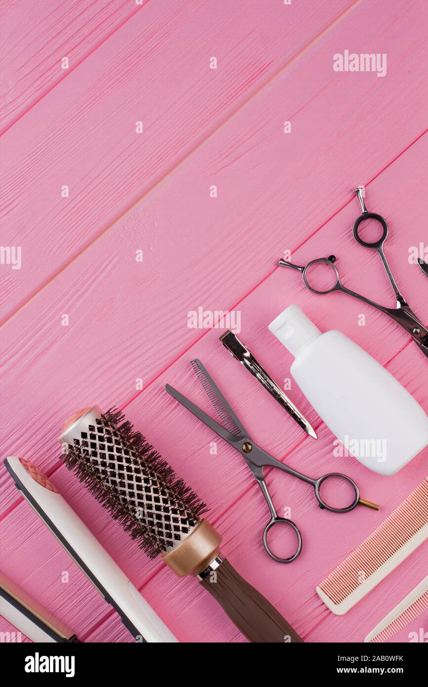 Hairdressing tools on pink background Stock Photo - Alamy