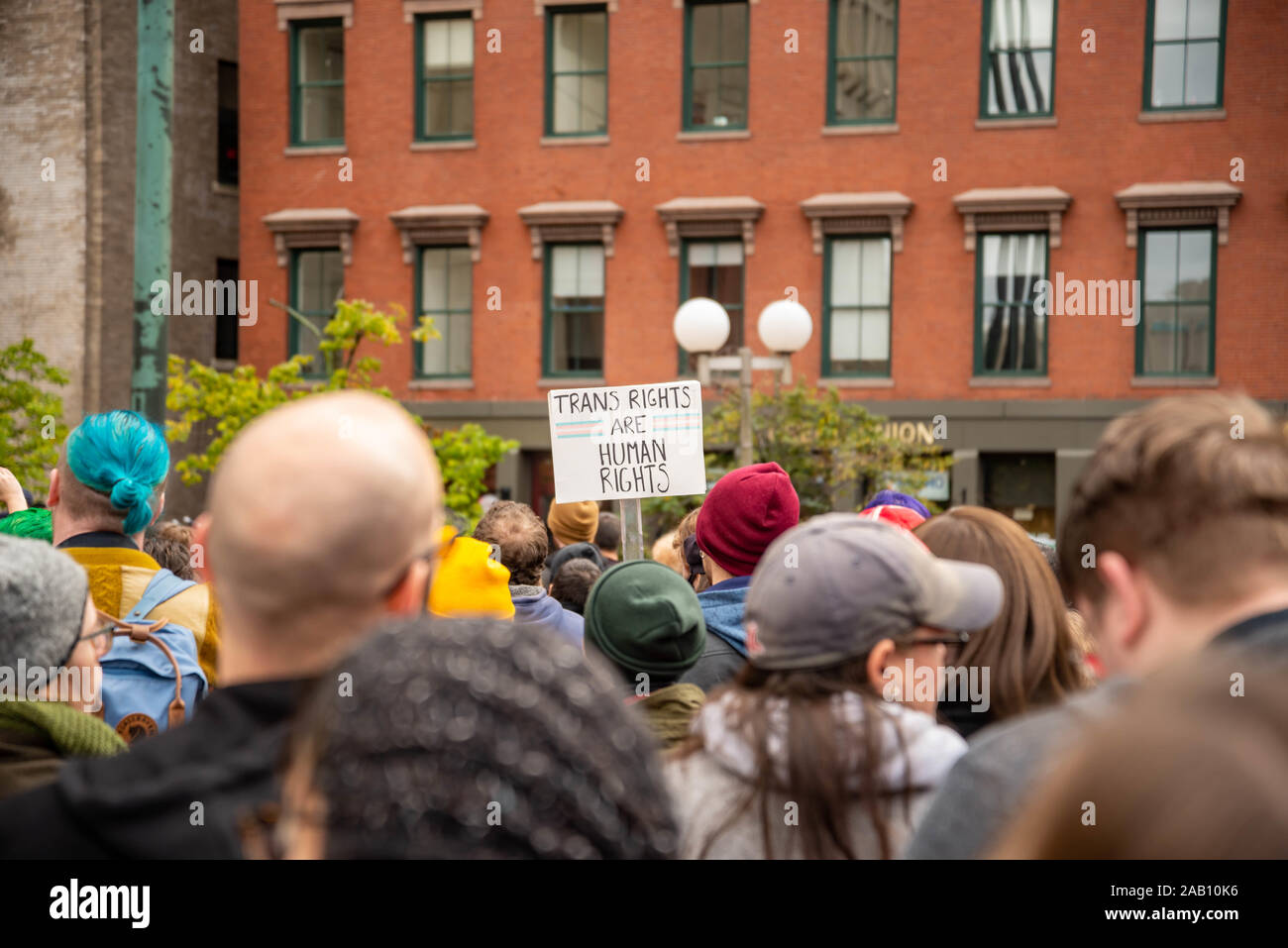 Protester marching for a peace pride rainbow flag at the Boston March ...