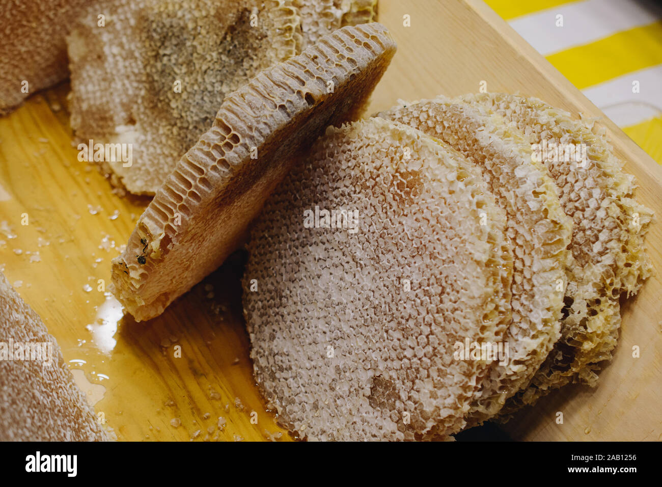 Honey in honeycomb from round beehive with sweet honey Stock Photo - Alamy