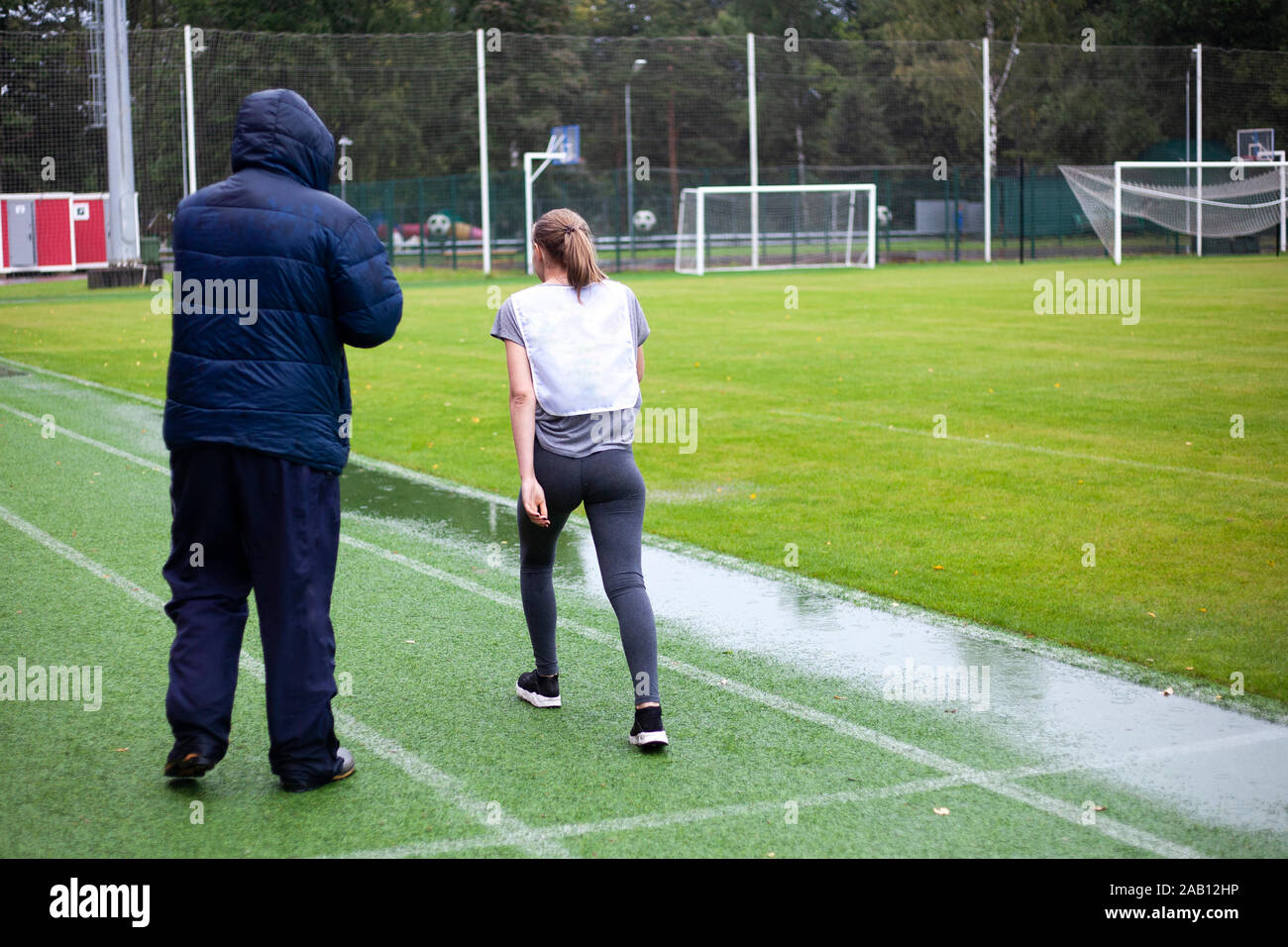 Time Running Sports Competition. Runner on a treadmill. A woman ...