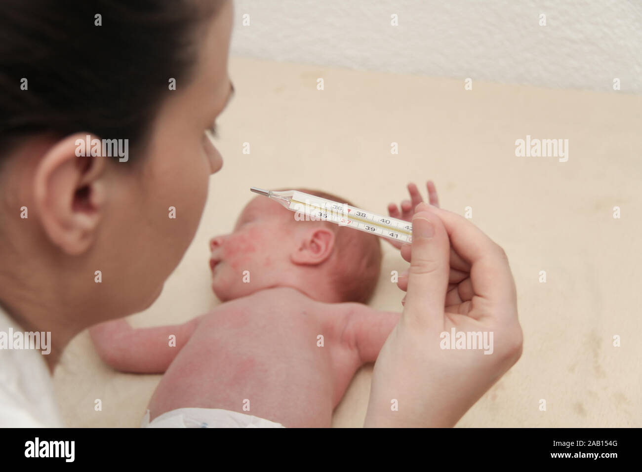 Photo of the Measuring the temperature of baby in thermometer Stock ...