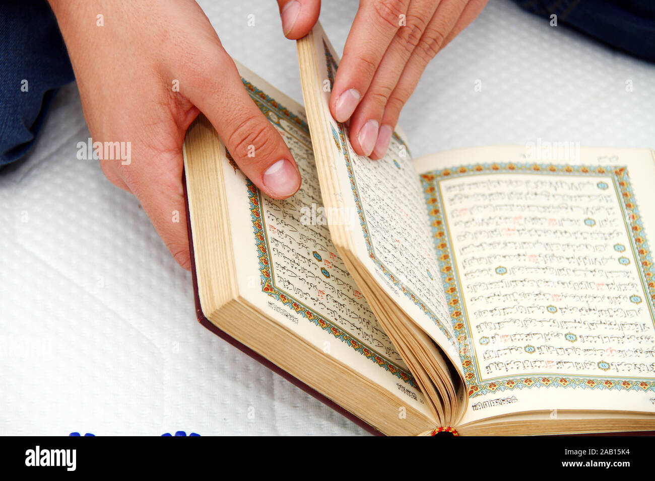 Photo of the Young man reading the Holy Koran Stock Photo - Alamy