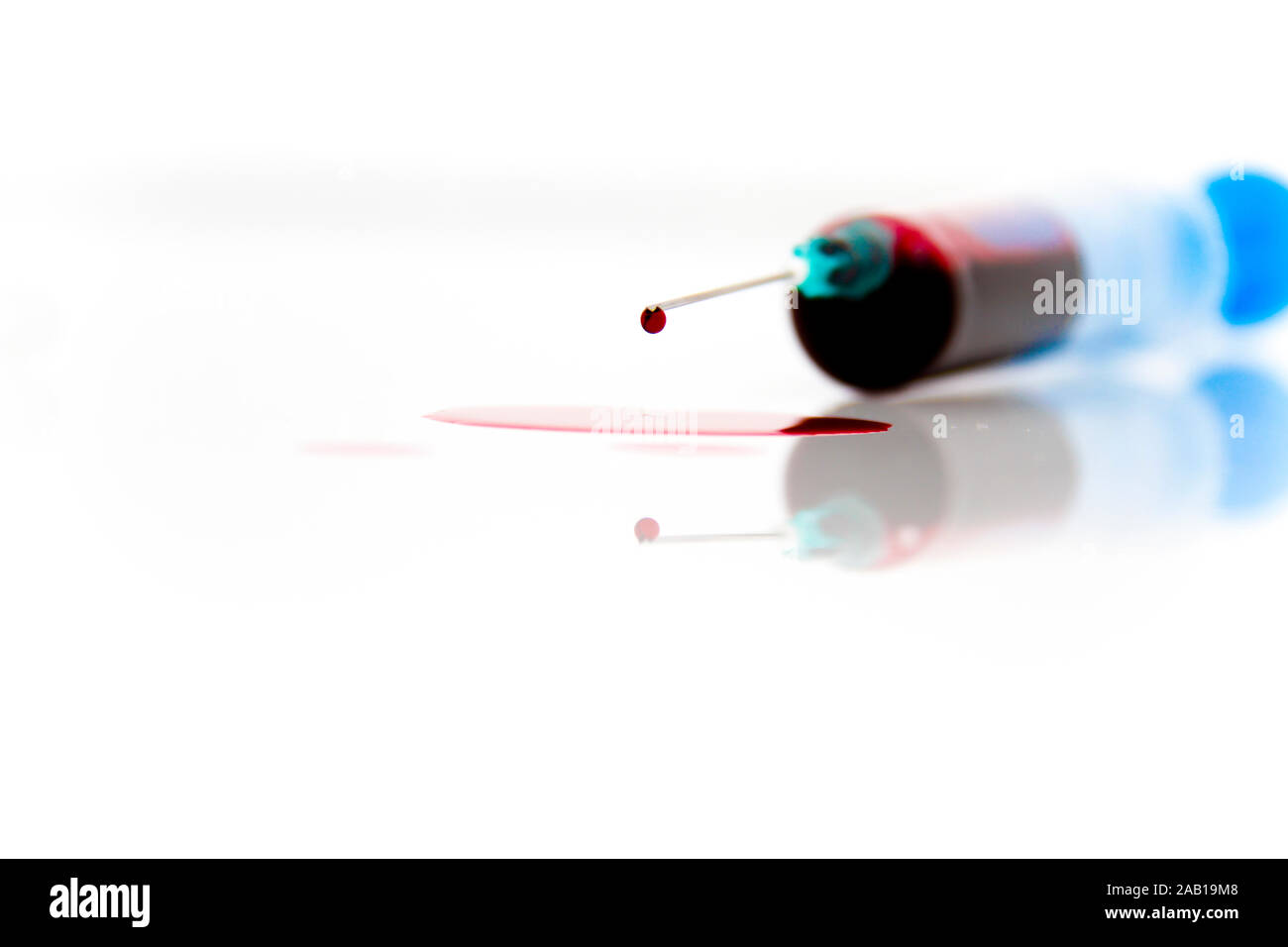 Photo of the Syringe in laboratory environment, blood and medical ...