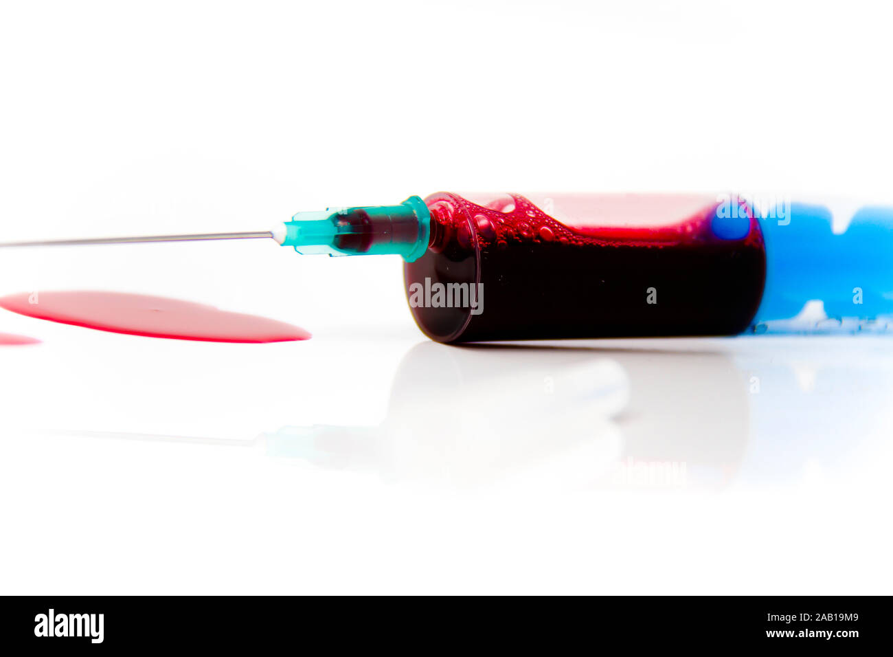Photo of the Syringe in laboratory environment, blood and medical ...