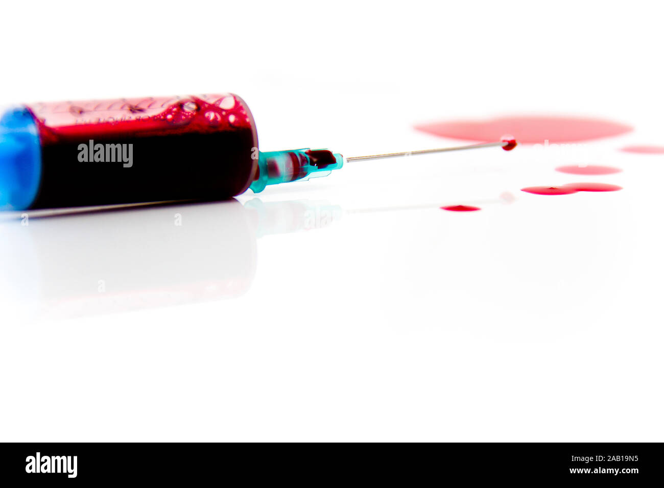 Photo of the Syringe in laboratory environment, blood and medical ...