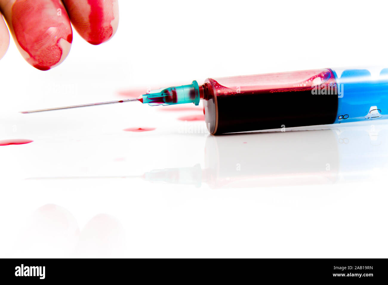Photo of the Syringe in laboratory environment, blood and medical ...