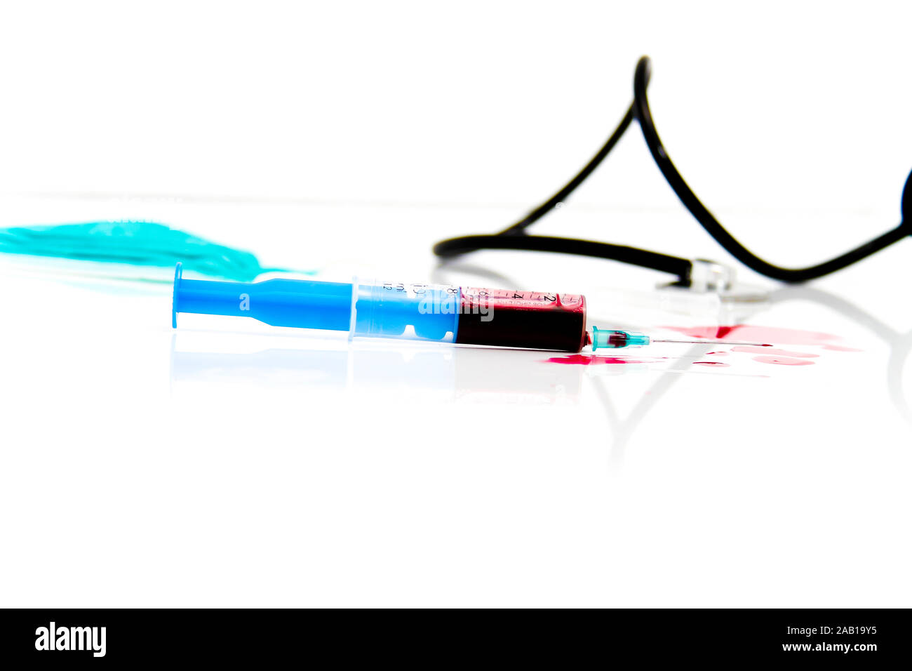 Photo of the Syringe in laboratory environment, blood and medical ...
