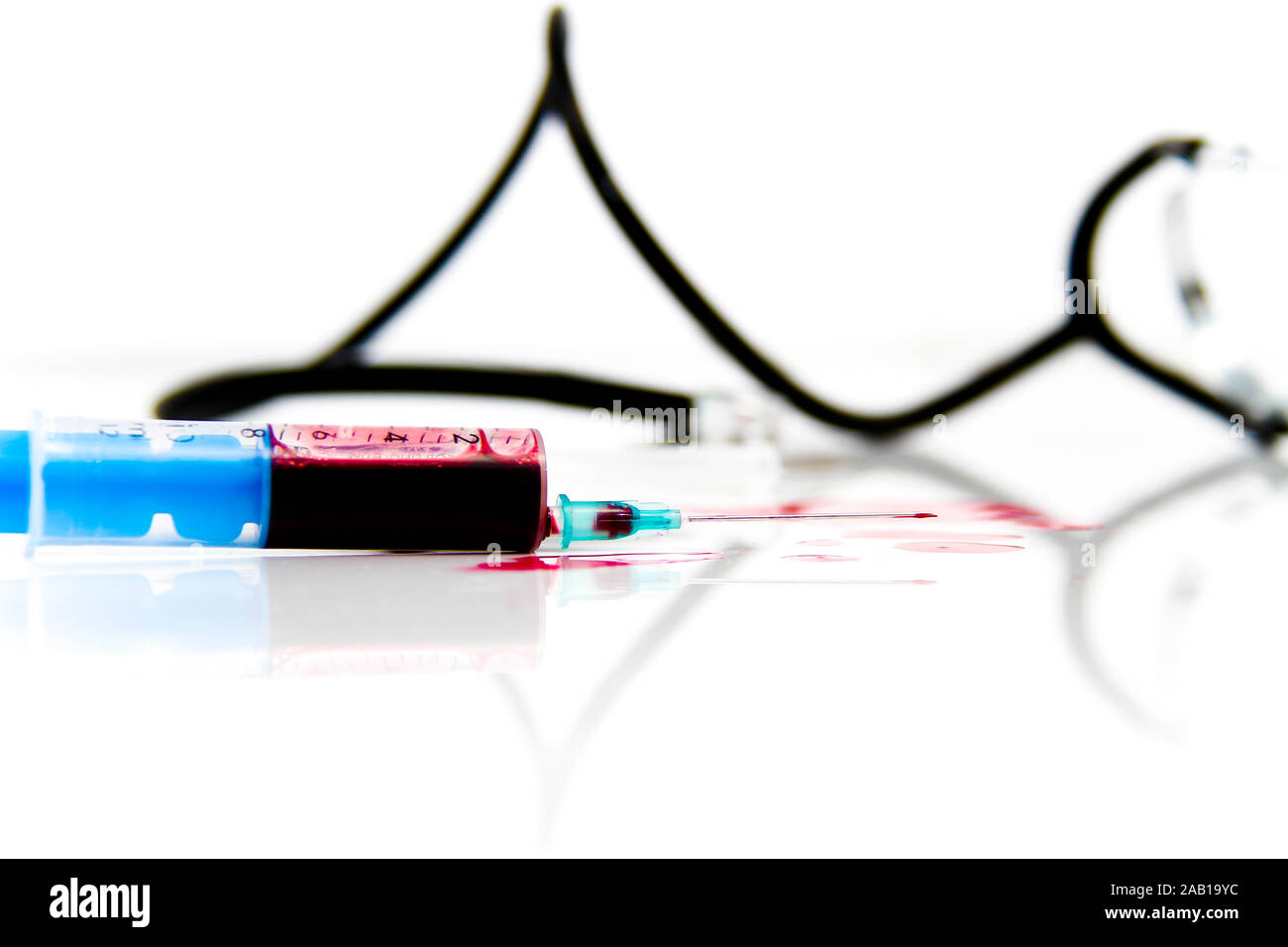 Photo of the Syringe in laboratory environment, blood and medical ...