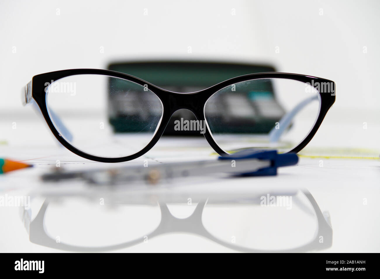 Photo of the Business Architectural project, pair of compasses, glasses ...
