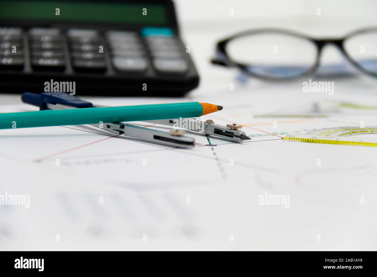 Photo of the Business Architectural project, pair of compasses, glasses ...