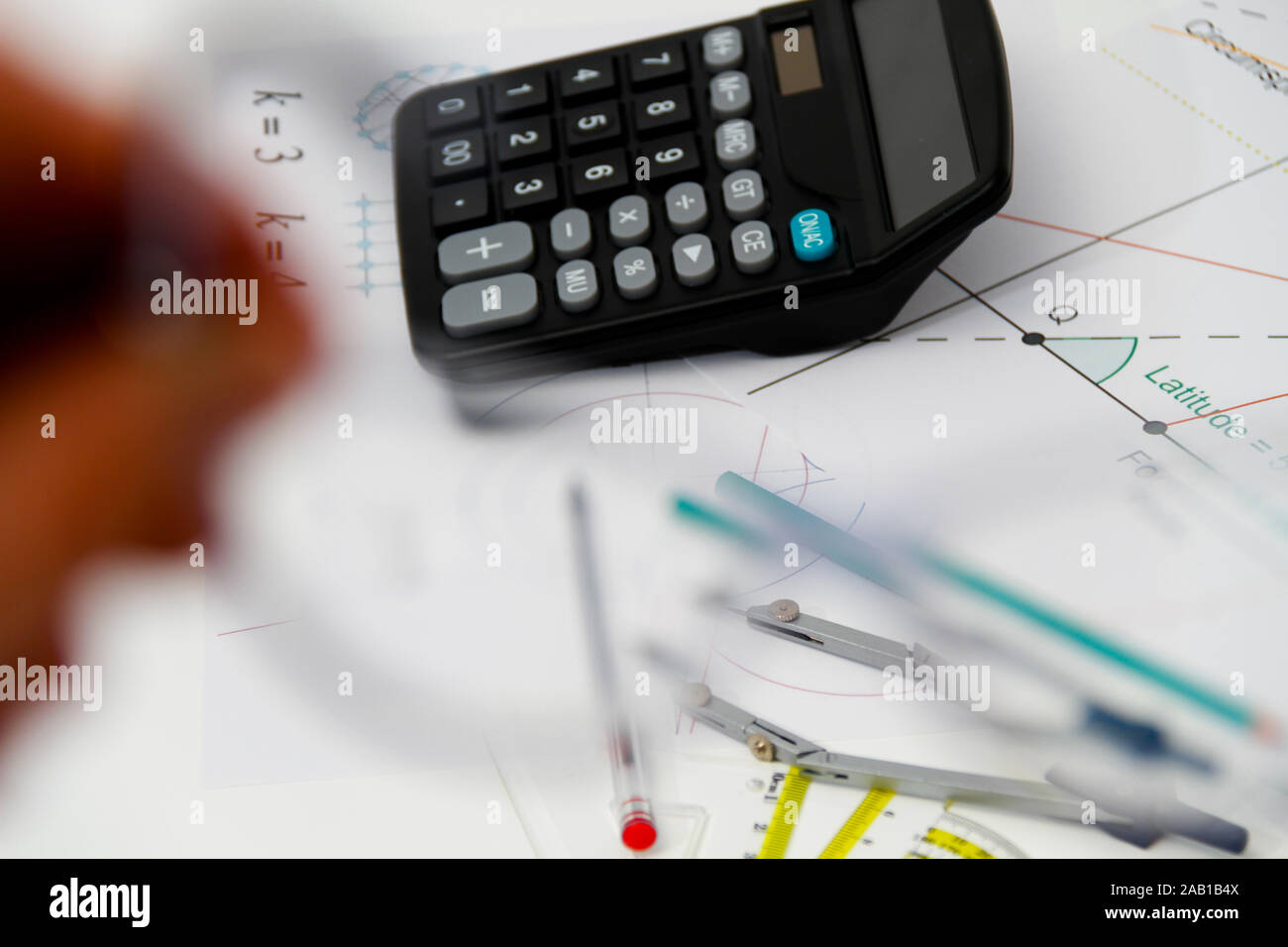 Photo of the Business Architectural project, pair of compasses, glasses ...