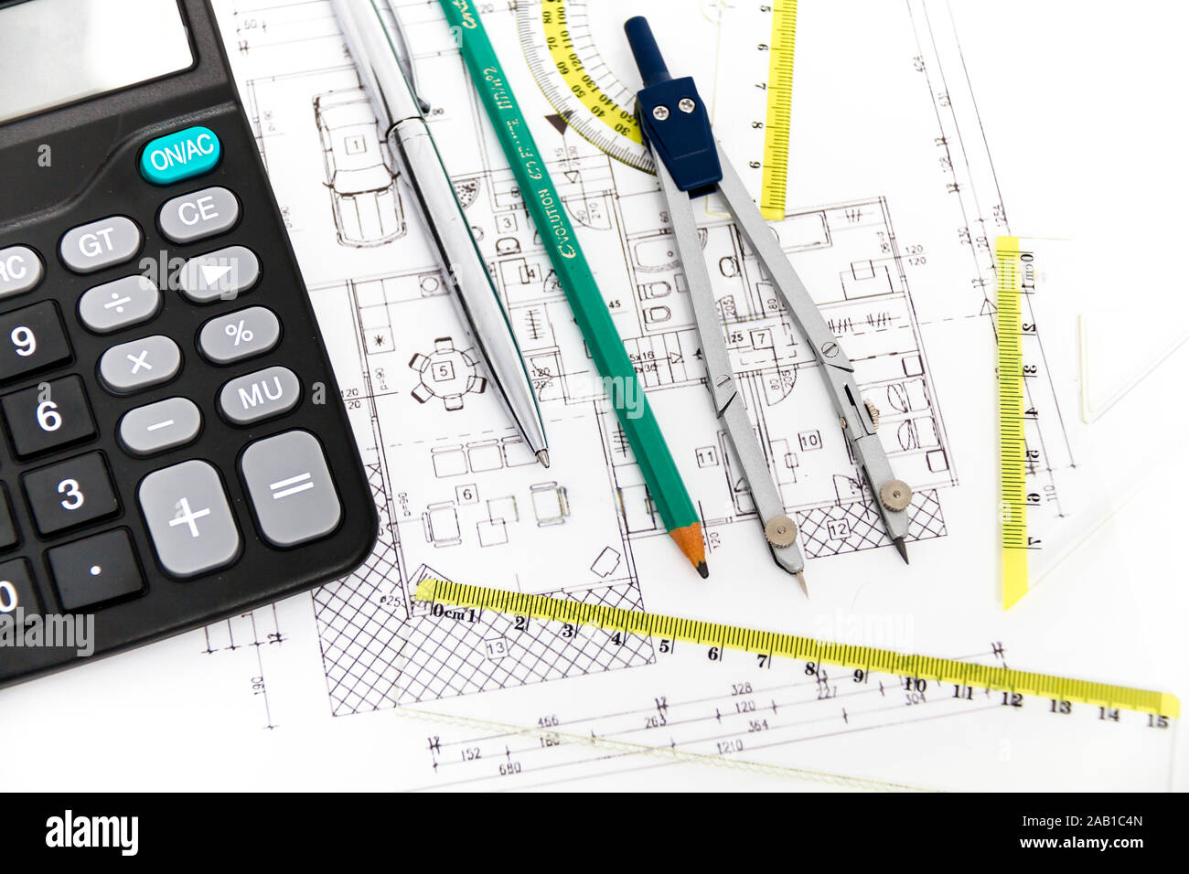 Photo of the Architectural project, pair of compasses, rulers and ...
